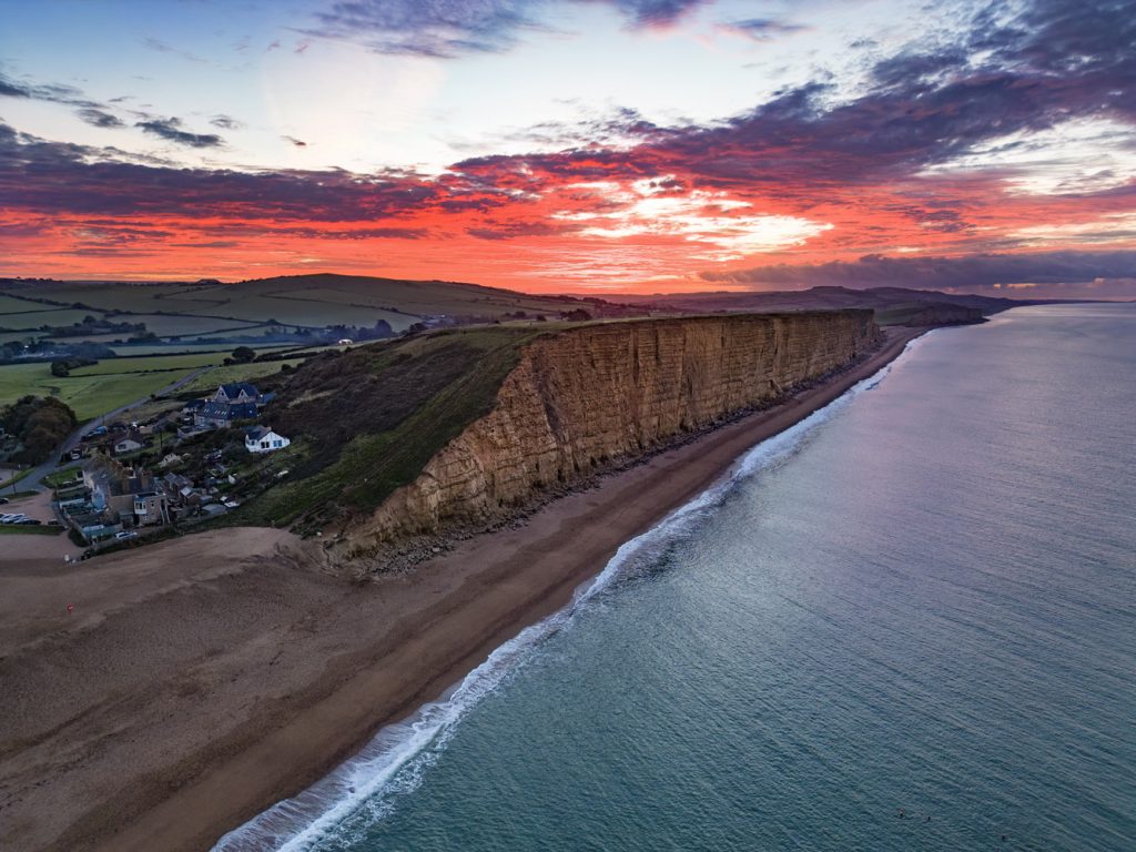 Fiery sunrise above east cliff – West Bay Pictures